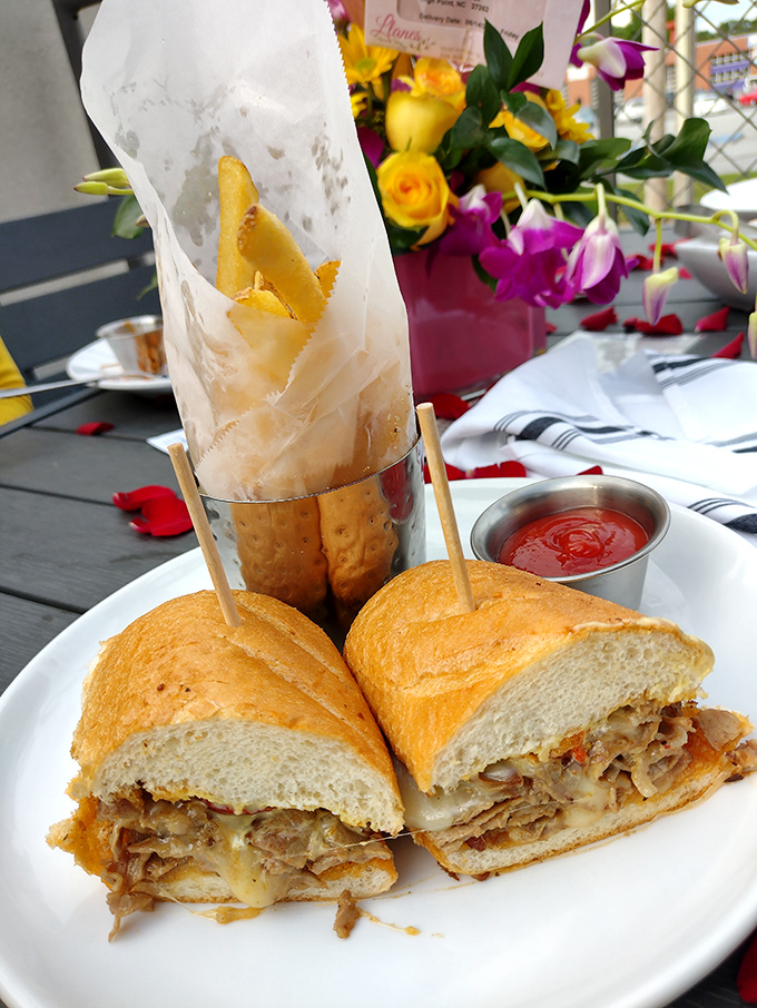 The French dip sandwich: where thinly sliced heaven meets crusty bread, with spring rolls standing by like delicious supporting actors.