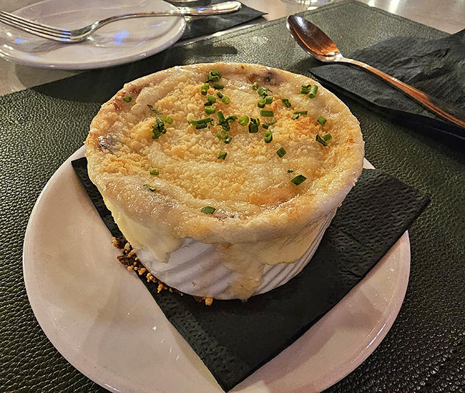 The legendary French onion soup, crowned with a golden dome of melted cheese that stretches dramatically with each spoonful &ndash; worth the trip alone.