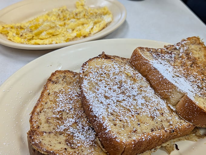 French toast dusted with powdered sugar alongside scrambled eggs&mdash;breakfast's perfect marriage. Like morning sunshine on a plate. 