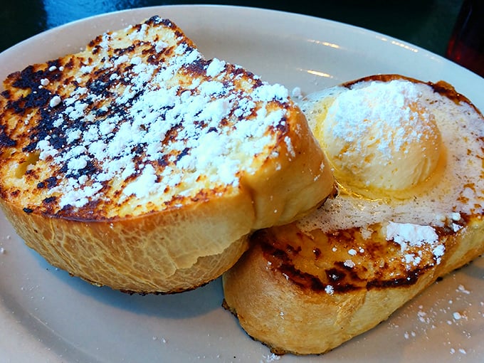 French toast that transforms ordinary bread into golden-brown perfection dusted with powdered sugar dreams.