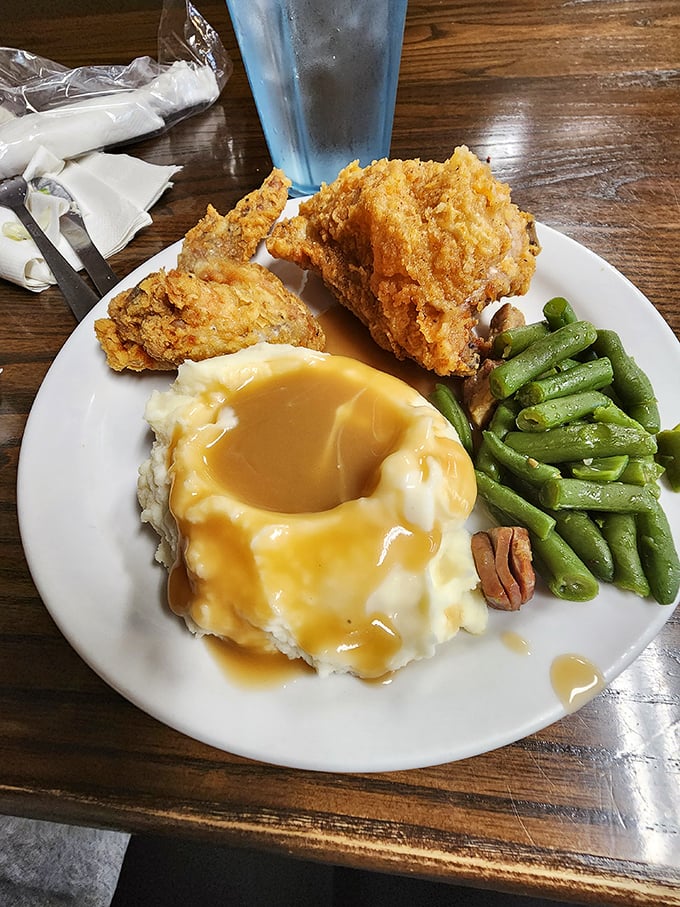 This isn't just fried chicken—it's edible nostalgia, perfectly golden with mashed potatoes standing by for gravy duty.