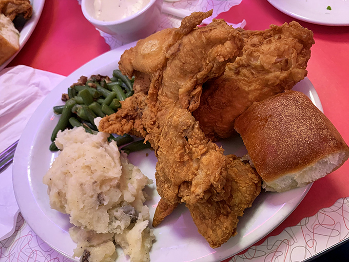 Fried chicken so golden it deserves its own trophy case, accompanied by mashed potatoes that clearly never came from a box.