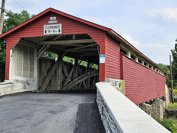 The bridge's classic red exterior pops against green landscapes like it's posing for its close-up, Mr. DeMille.