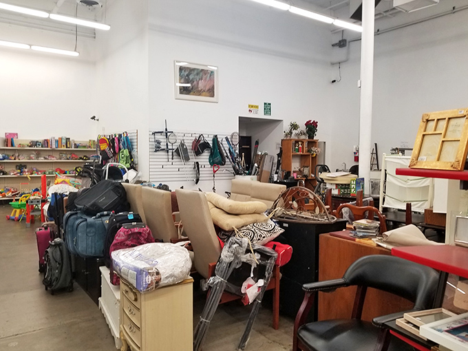 The furniture section: where mid-century meets last-Tuesday in a glorious jumble that would make Marie Kondo simultaneously faint and applaud.