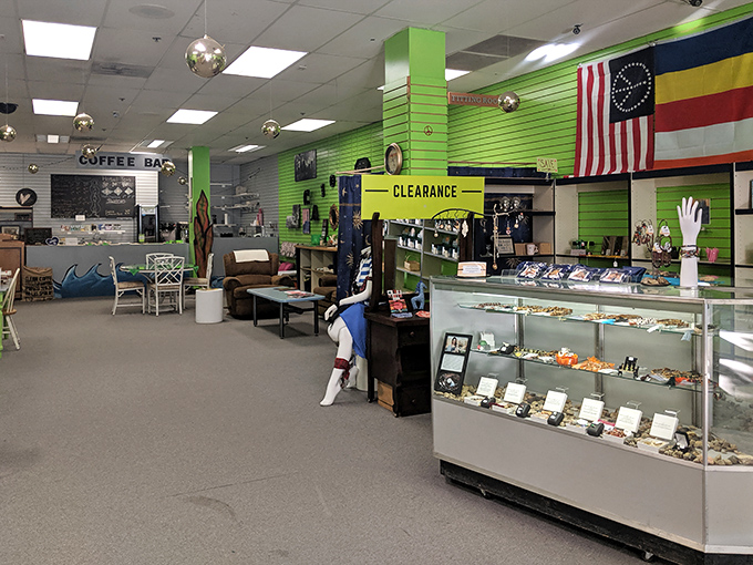 A vibrant green oasis of eclectic treasures where coffee, books, and vintage-inspired decor create a charming break from mainstream shopping.