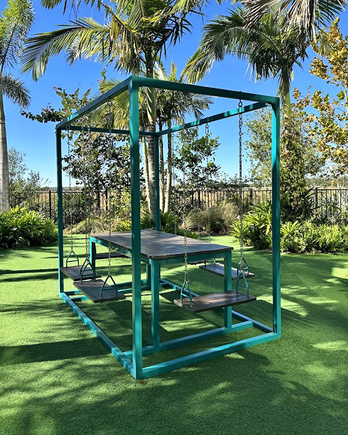 Not your average playground equipment! This turquoise swing structure invites adults to reconnect with childlike wonder while surrounded by tropical splendor.