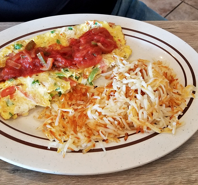 The Spanish omelet brings a fiesta to your morning, topped with salsa that would make your abuela nod in approval.