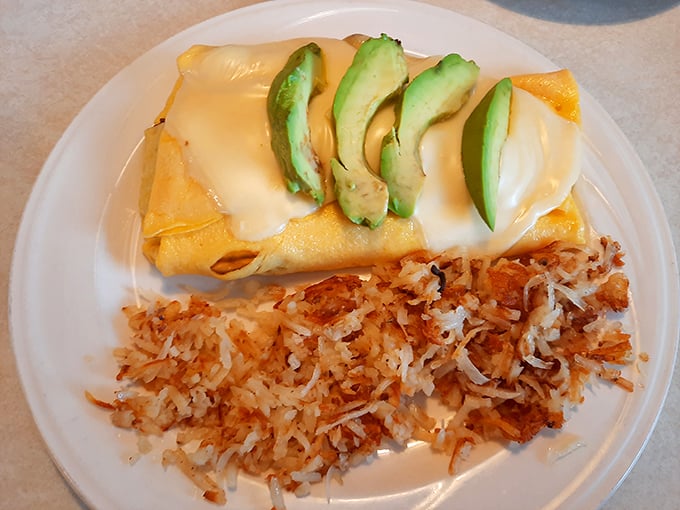 An omelet draped in melty cheese with perfectly crisp hash browns &ndash; the breakfast equivalent of hitting all green lights on your morning commute.