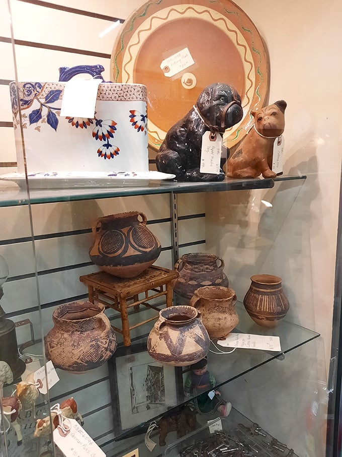 Ceramic dogs with price tags around their necks sit patiently next to earthenware that's survived longer than most modern relationships.