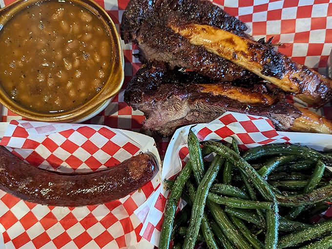 A barbecue quartet: tender ribs, smoky beans, garden-fresh green beans, and a hot link that brings just enough heat to the party.