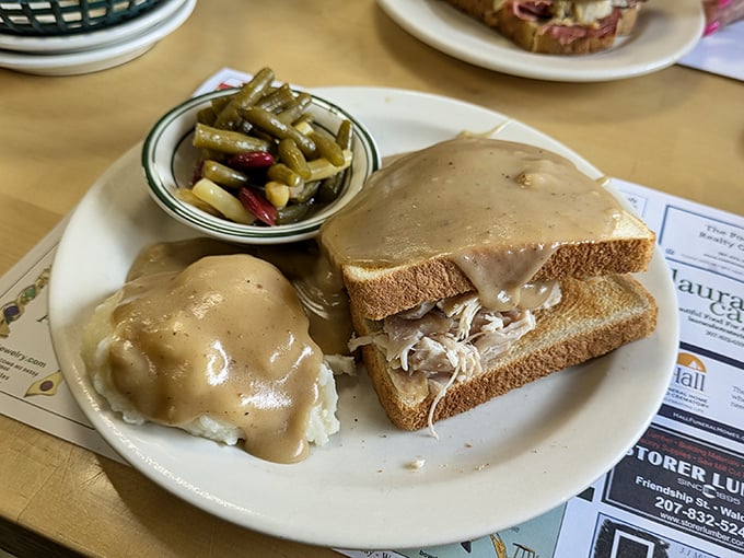 Hot turkey sandwich with real carved meat, proper gravy, and sides that remind you why this classic never goes out of style.