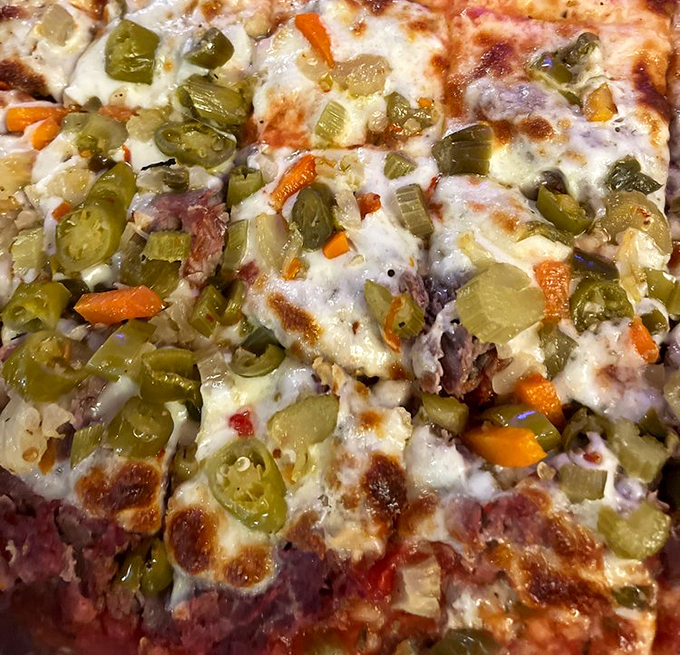 When giardiniera meets melted cheese, magic happens. This pizza doesn't need a passport to Italy&mdash;it's pure Illinois comfort in circular form.