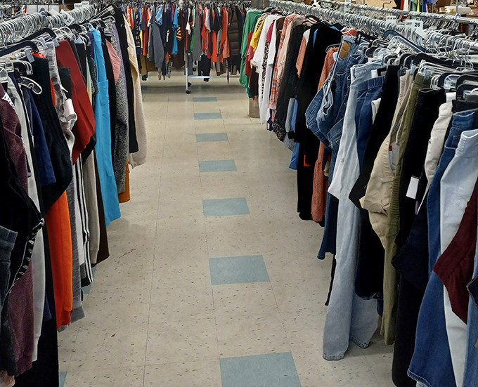 The clothing aisles stretch like runways of possibility. Each hanger holds a potential wardrobe transformation waiting to happen.