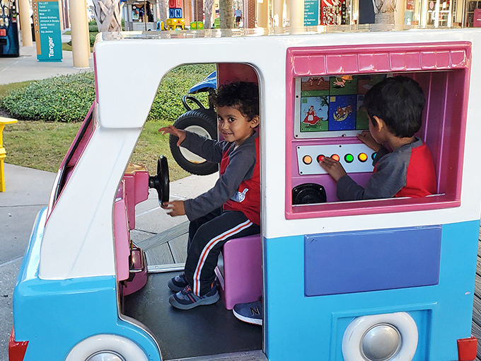 Future shoppers in training! These kiddie rides are strategically placed to entertain the little ones while parents debate the merits of one more store.