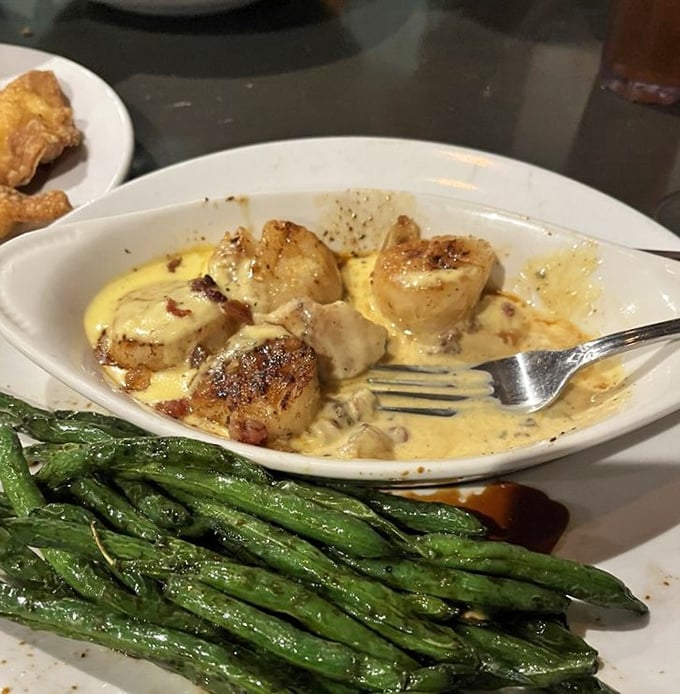 These scallops aren't just seared—they're transformed into buttery islands of joy floating in a sea of creamy sauce. The asparagus provides the perfect green counterpoint.