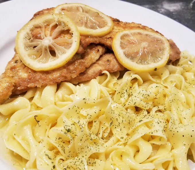 The lemon chicken isn't playing around&mdash;those golden cutlets topped with fresh lemon slices over buttery noodles are what food dreams are made of.