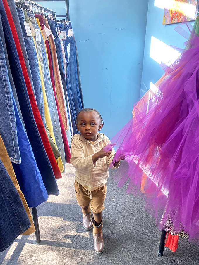 The next generation of thrift enthusiasts discovers the magic of purple tulle, proving good taste starts early.