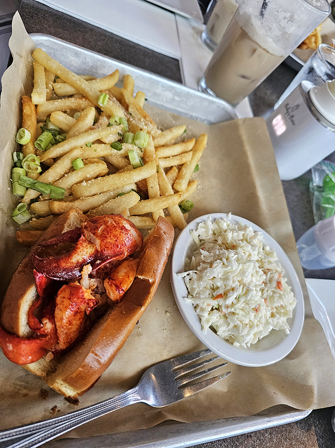 The legendary lobster roll&mdash;chunks of sweet meat nestled in a buttery vessel, with fries and slaw standing by as worthy sidekicks.