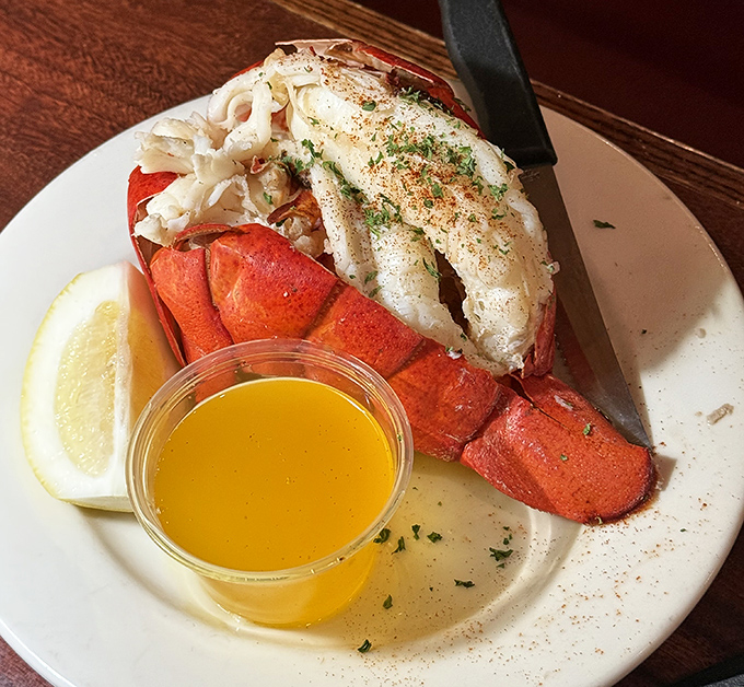 This lobster tail isn't just served; it's presented like the seafood celebrity it is, with butter playing the role of liquid gold.