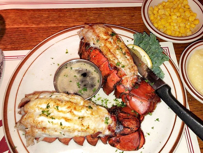 Twin lobster tails presented with military precision, flanked by melted butter &ndash; simplicity that speaks volumes about seafood confidence.