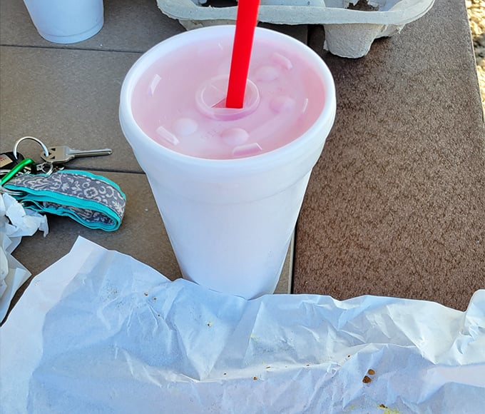 A strawberry milkshake so thick the straw stands at attention&mdash;summer in a styrofoam cup, pink as a Midwest sunset.