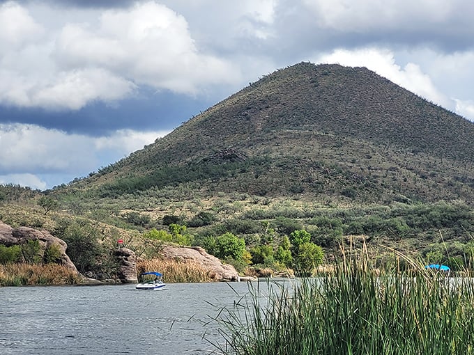 The mountain stands sentinel over the lake like a protective parent, watching over swimmers who squeal with delight at finding actual water in Arizona.