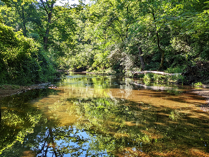 The creek that gave this landmark its name offers a peaceful soundtrack and mirror-like reflections that photographers dream about.