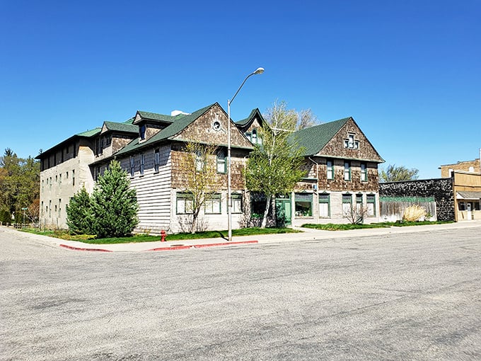 Rustic charm meets practical architecture in this multi-story building, where weathered shingles tell stories of decades gone by under that endless Idaho sky.