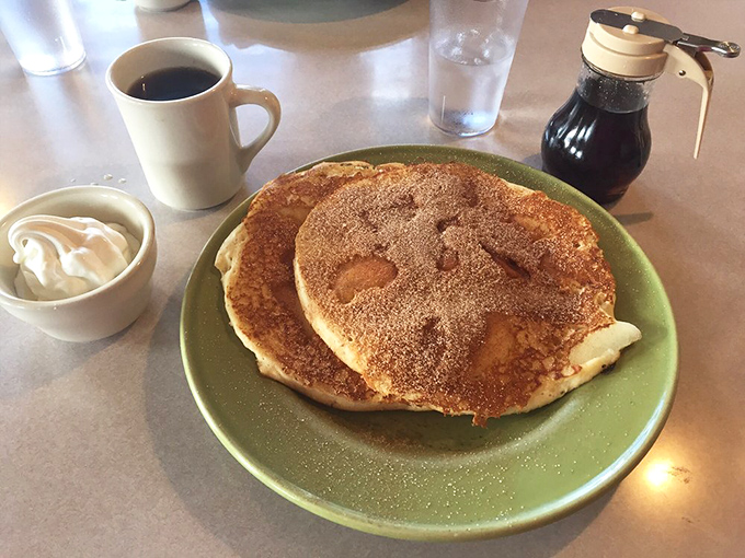 These pancakes achieve that rare combination of fluffy interior and golden exterior that makes syrup application an art form.