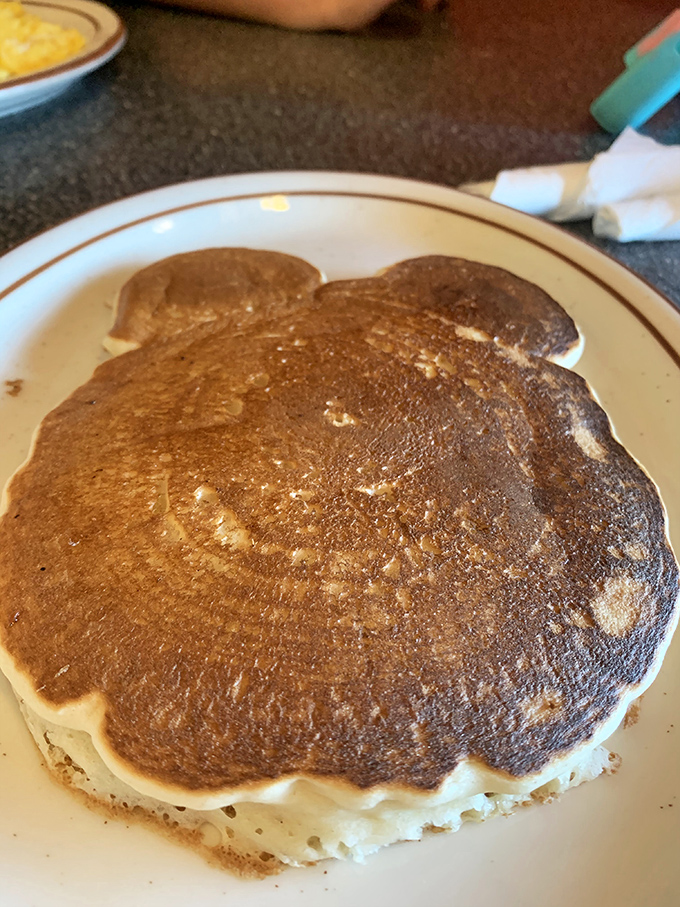 The pancake that ate Fresno! This magnificent carb canvas doesn't just hang over the edge of the plate &ndash; it establishes dominance over it.