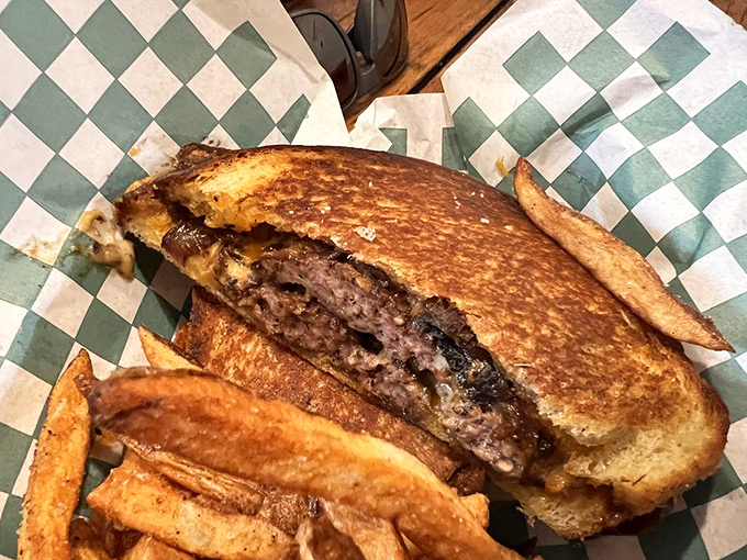 The patty melt that makes you question all your previous relationships with grilled cheese. That golden exterior hides a beefy secret worth discovering.