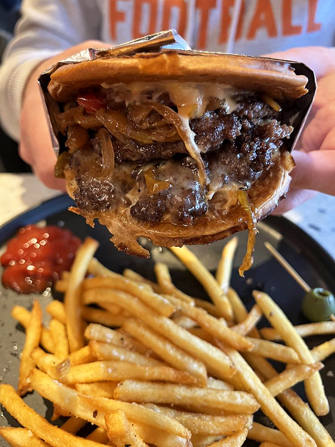 The patty melt here doesn't just satisfy hunger&mdash;it obliterates it with caramelized onions cascading over melted cheese and beef like a savory waterfall.
