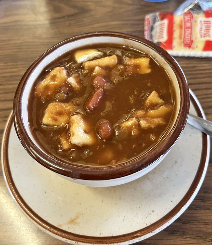 This pea and ham soup arrives steaming hot, packed with chunks that prove vegetables and meat can peacefully coexist.