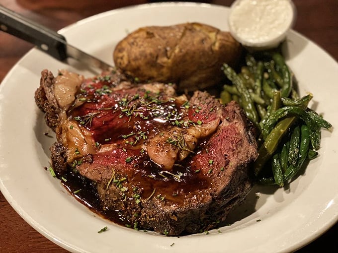 This prime rib isn't just dinner &ndash; it's a carnivore's sonnet, with that rosy center and herb-flecked crust playing perfect harmony with those vibrant green beans.
