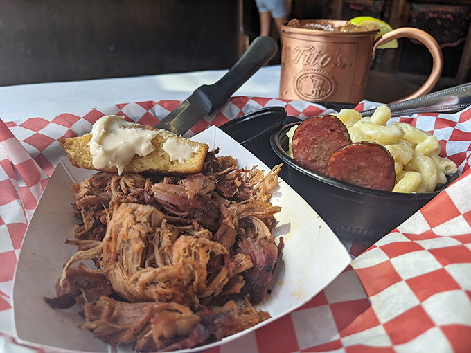 Pulled pork that surrendered to smoke and time, paired with mac and cheese that's having its own creamy identity crisis.