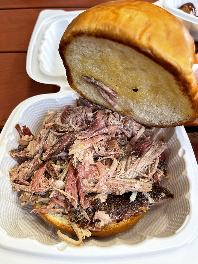 This pulled pork sandwich isn't just a meal, it's an edible love letter from the smoker, complete with a golden-brown bun messenger.
