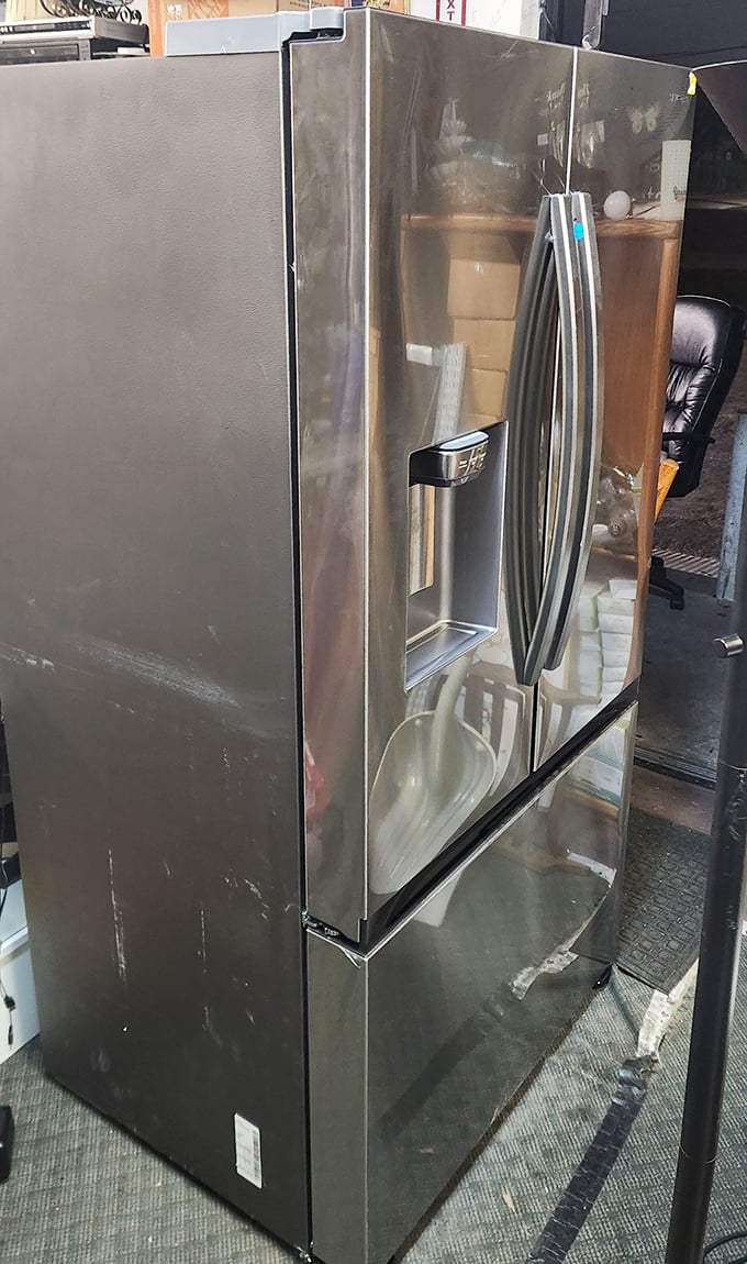 Stainless steel refrigerator looking so pristine, you'd never guess it's embarking on its second career. Marie Kondo would approve of this joyful transition.