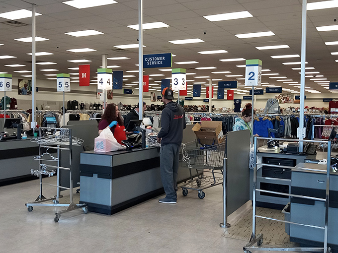 The checkout area—where hopes, dreams, and bargains converge before heading home to their new lives of purpose.