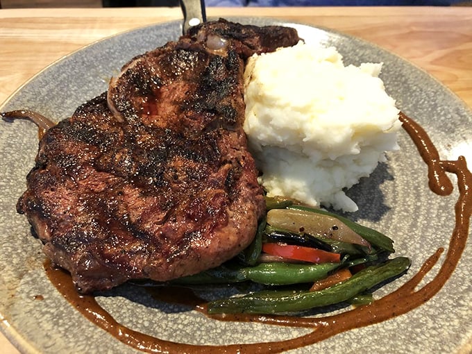 A perfectly seared ribeye that would make even the most devoted seafood fan temporarily switch allegiances. Mashed potatoes so creamy they deserve their own fan club.