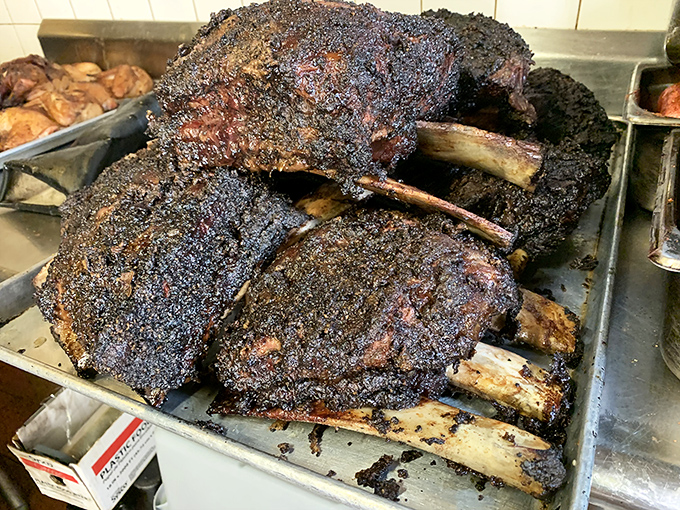Behold the BBQ equivalent of a Renaissance painting—beef ribs with a bark so beautiful it should hang in a museum of meat masterpieces.