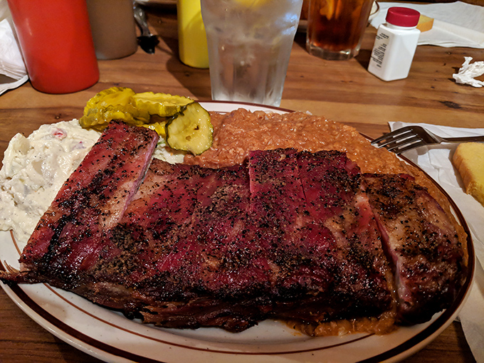 These ribs aren't just dinner, they're an archaeological expedition through layers of smoke, spice, and time-honored technique.