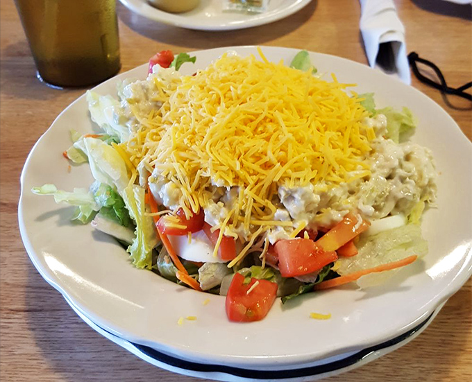 This isn't just a salad&mdash;it's a colorful landscape of fresh vegetables crowned with a sunshine-yellow mountain of shredded cheddar.