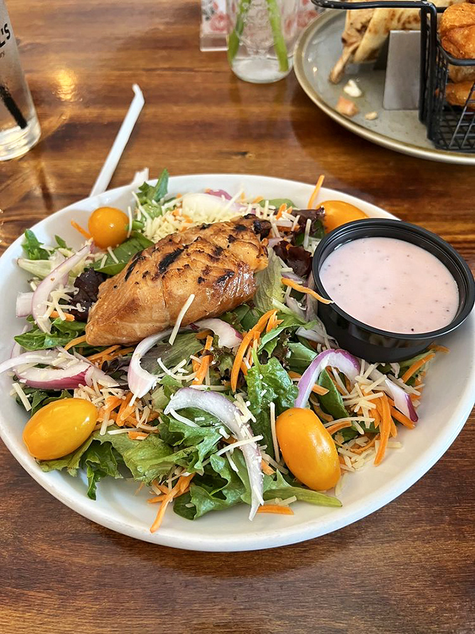 A salad that actually satisfies? This grilled chicken masterpiece proves healthy eating doesn't have to feel like punishment. Those yellow tomatoes are little bursts of sunshine.
