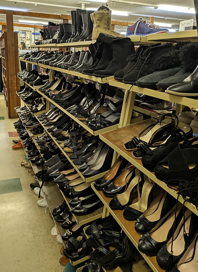 Shoe mountain! A footwear archaeologist's dream dig site where vintage boots and barely-worn heels tell stories of dance floors and hiking trails past.
