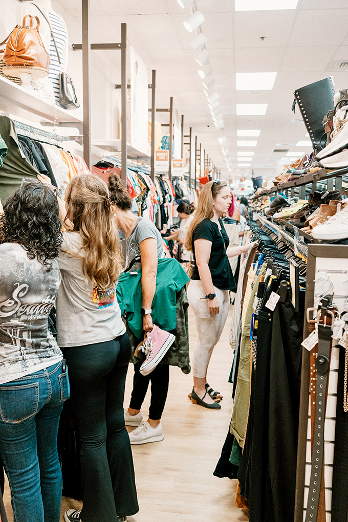 Treasure hunters in their natural habitat. The thrill of the find brings shoppers together in this fashion democracy.