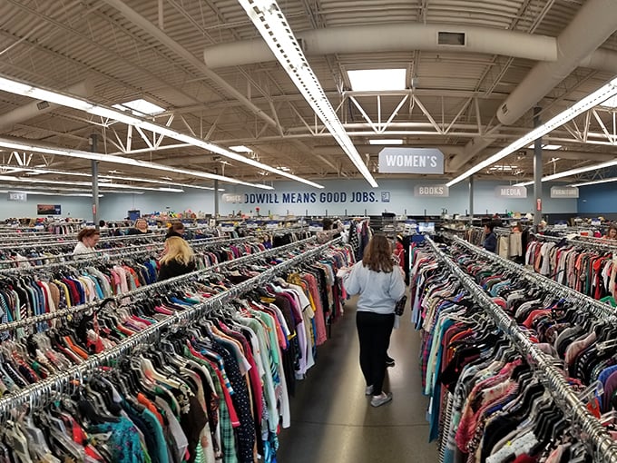 Shoppers navigate the well-organized clothing universe, where "Goodwill means good jobs" isn't just a slogan but a mission in action.