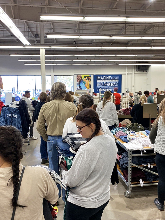 Bargain hunters in their natural habitat, sifting through racks with the focus and determination of archaeologists uncovering ancient treasures.