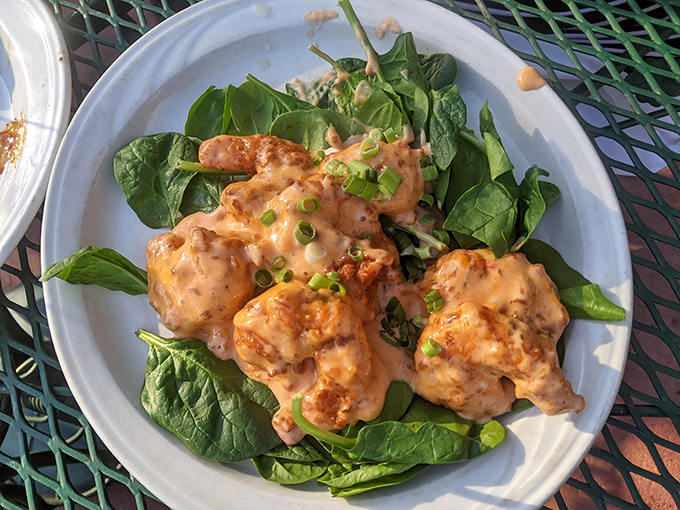 These golden-fried shrimp nestled on fresh spinach aren't just appetizers&mdash;they're little crispy ambassadors from the ocean to the prairie.