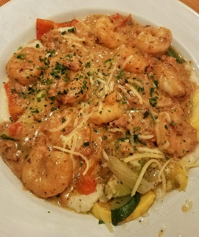 The dish that launched a thousand road trips. Plump shrimp lounging on a bed of creamy grits with vegetables playing supporting roles.