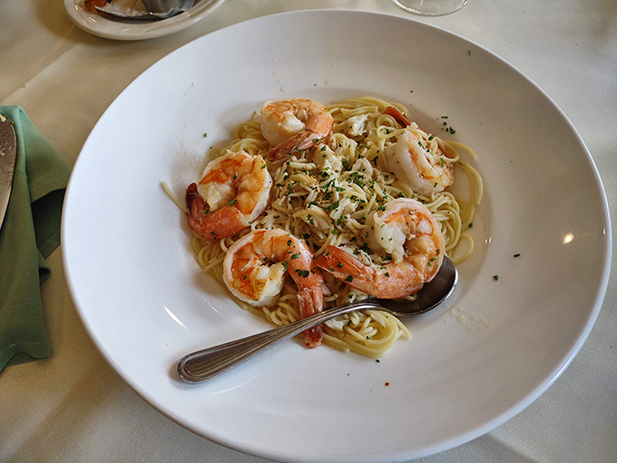 Shrimp scampi that would make an Italian grandmother nod in approval. Those plump shrimp lounging on a bed of pasta are basically having their own little spa day in garlic butter.
